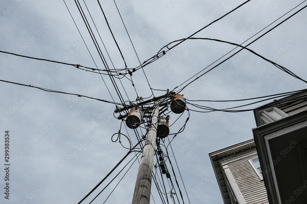 High voltage power cable seen atop a trio of transformers with cables ...