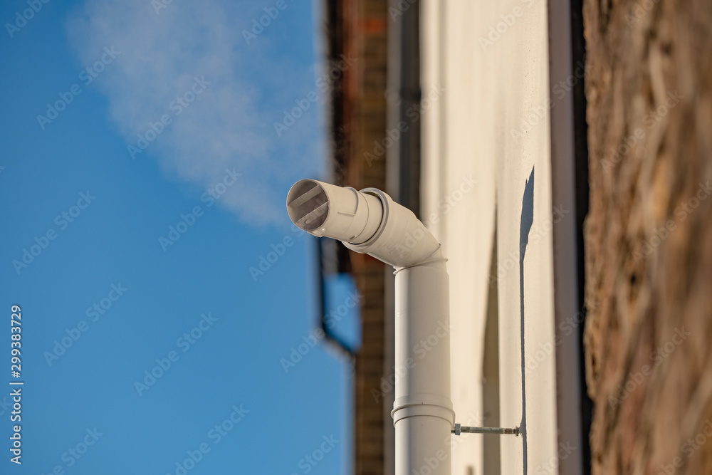 Detailed view of a newly installed steam ventilation pipe attached to a ...