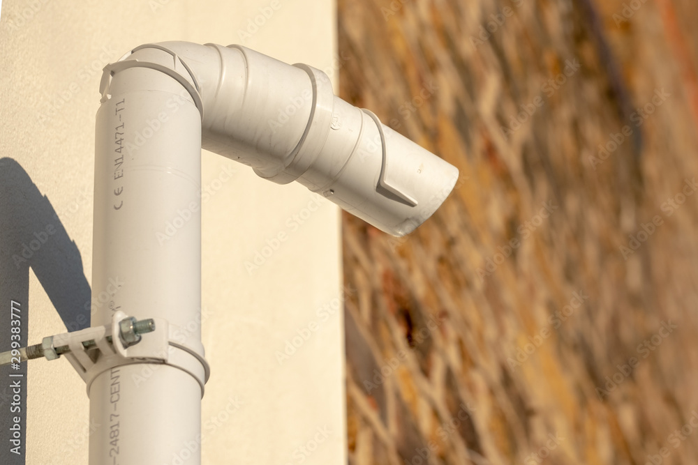 Detailed view of a newly installed steam ventilation pipe attached to a ...