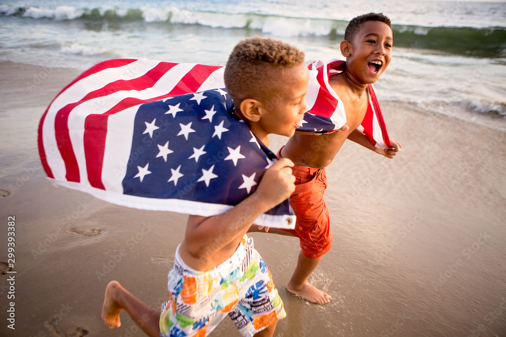 Patriotic fun at the beach brothers running with the American flag ...