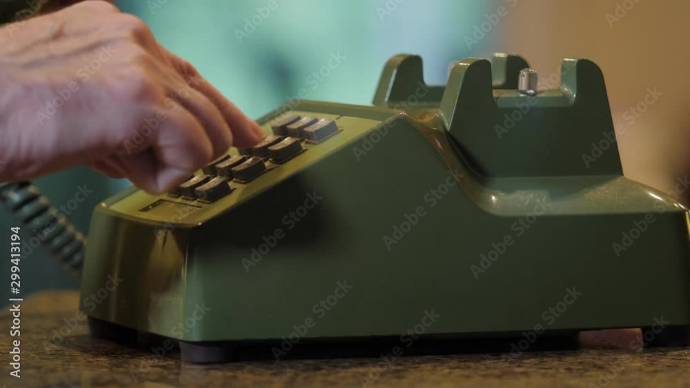 Man dialing retro push button rotary dial telephone. Making phone call ...