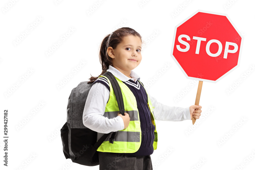 Schoolgirl with a stop sign and wearing a safety vest on white ...