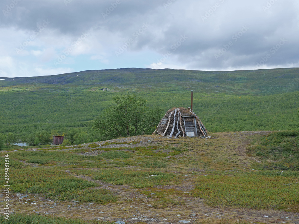 Abadoned Sami hut Goathi in green hills landscape of Abisko National ...
