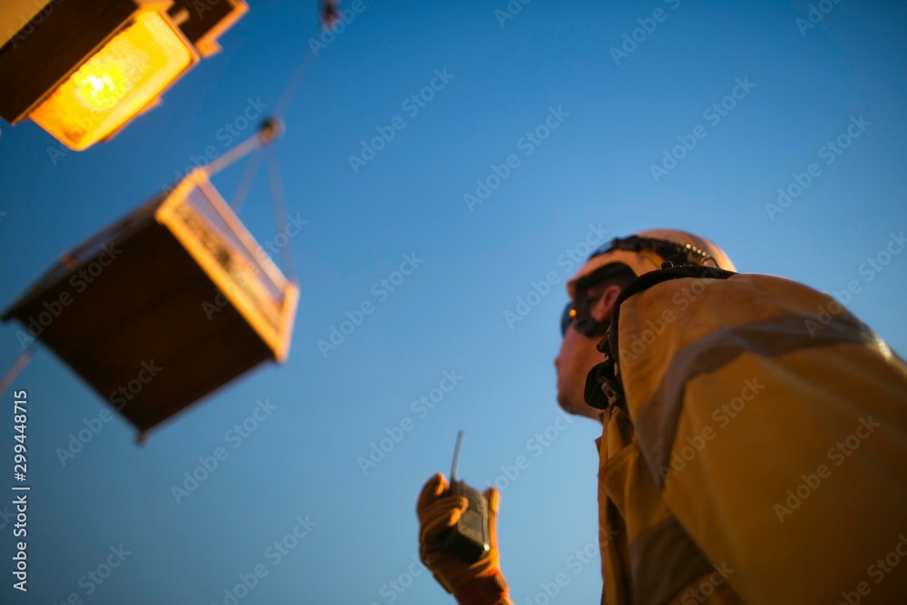 Defocused picture of rigger crane operator miner wearing helmet, using ...
