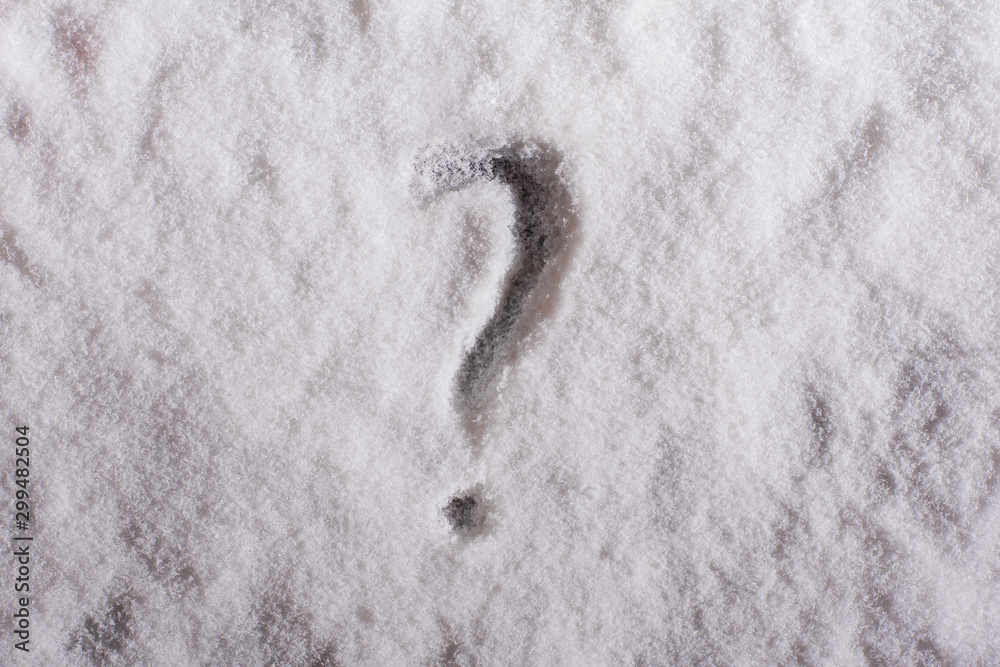 Question mark on the night snow. Texture and background. Top view ...