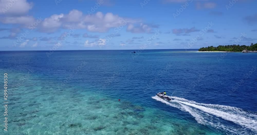 Fast and furious Jet Ski dashing around the wide depth ocean under the ...