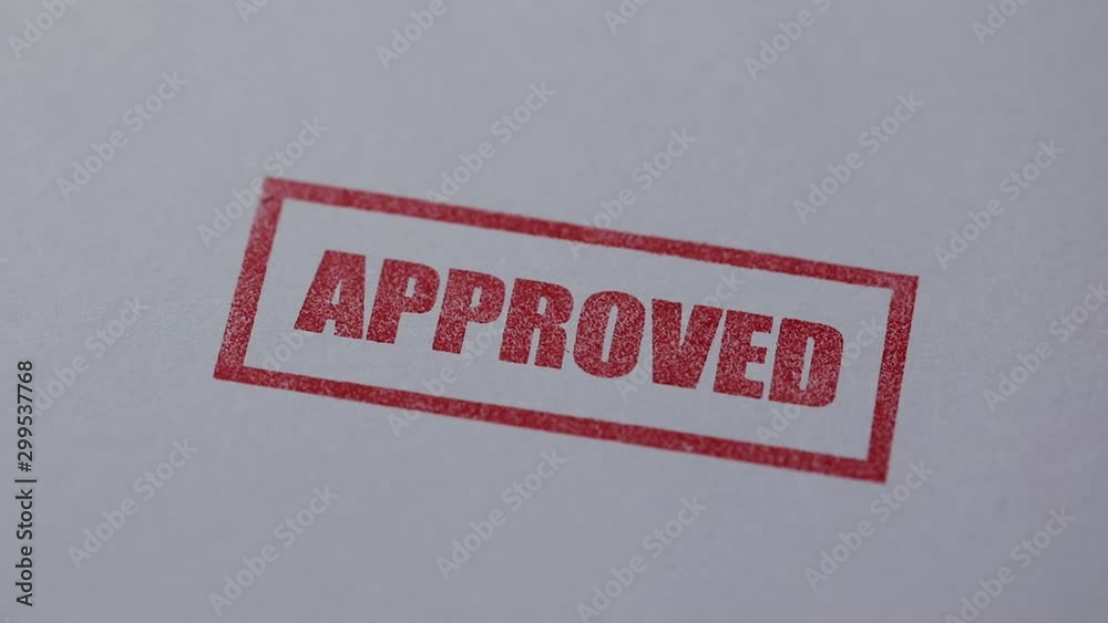 hand put a red approved stamp on white paper Stock Video | Adobe Stock