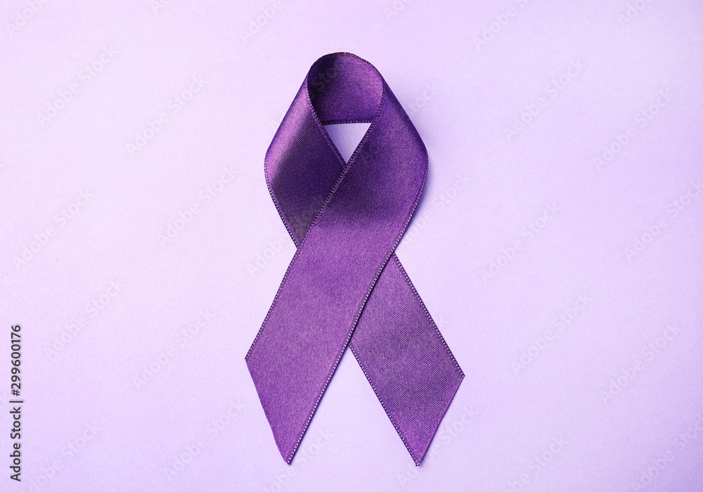 Purple ribbon on lilac background, top view. Domestic violence ...