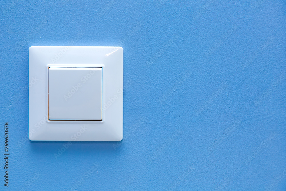 Poster a light switch, a plastic mechanical button of white color ...