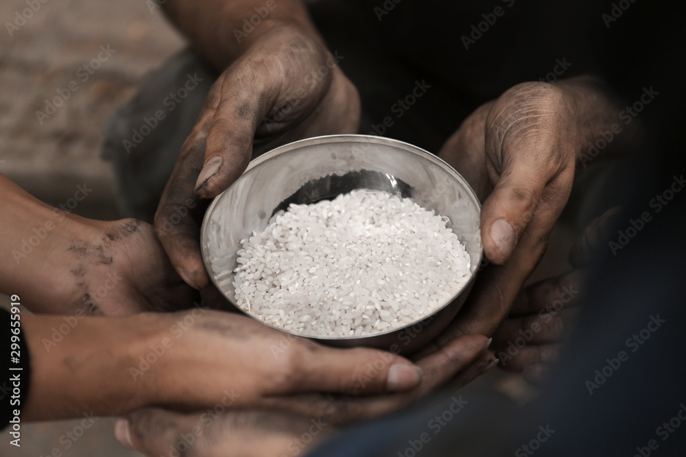 Poor homeless people with bowl of rice outdoors, closeup Stock-Foto ...
