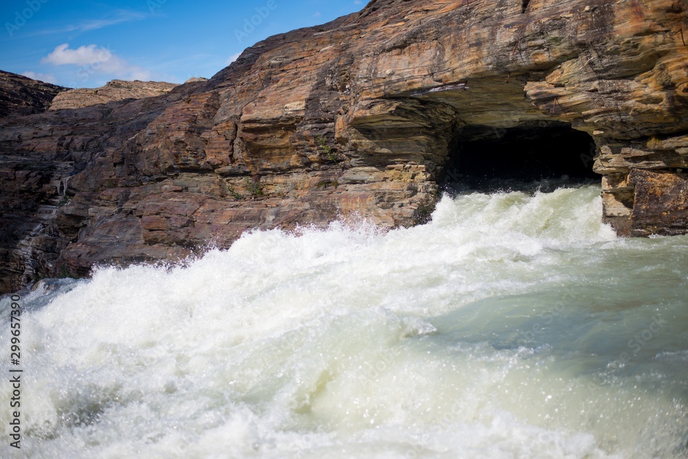 Lumps of water pouring from the inside of a cave in a stone rock Stock ...