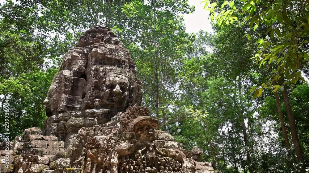 4K, Face towers of Ta Som temple. Smiling faces made of stone in Angkor ...