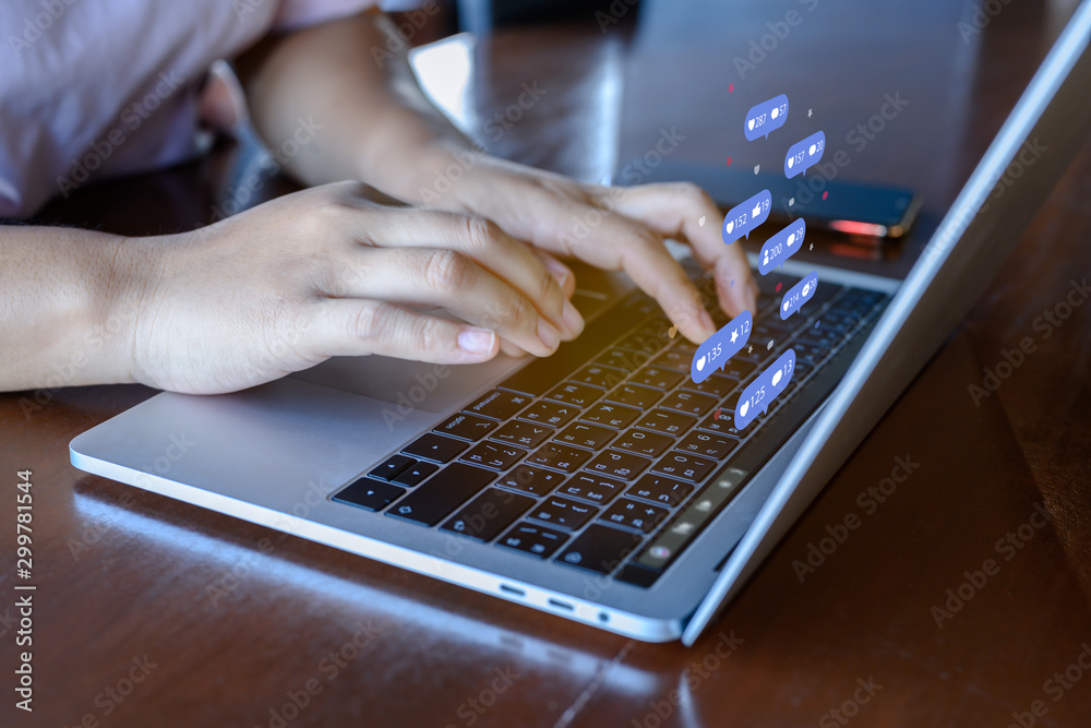 Person using a social media marketing concept on laptop computer with ...