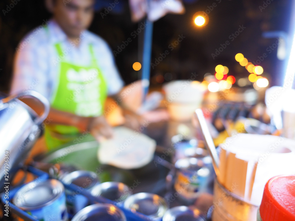 Blur image of cooking egg Roti over hot pan with palm oil in old style ...