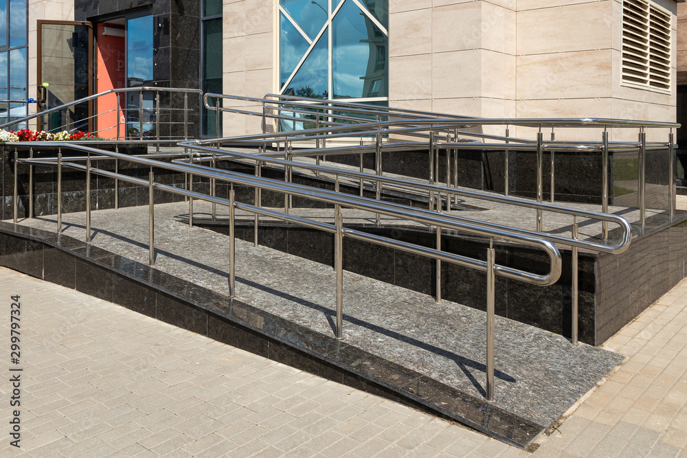 Wheelchair ramp of two uneven horizontal surfaces, street view, window ...