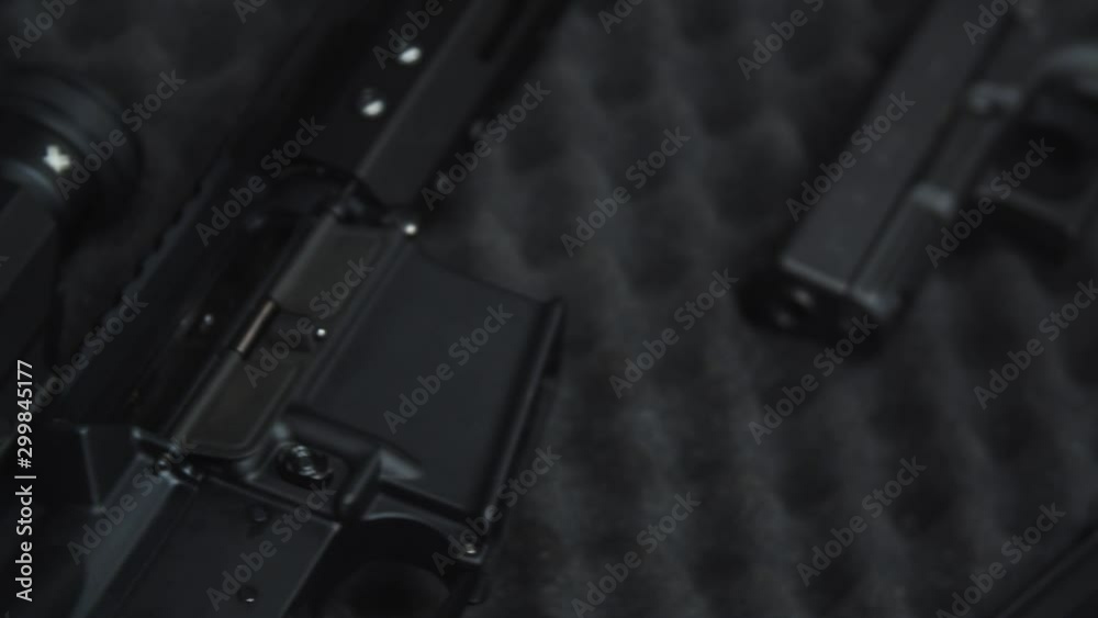 Handheld tracking shot left to right, panning over an arsenal of ...