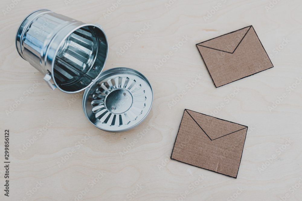 decluttering your inbox, email envelopes and garbage bin on desk Stock ...