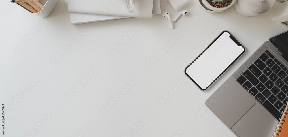 Top view of modern office room with blank screen smartphone and office ...