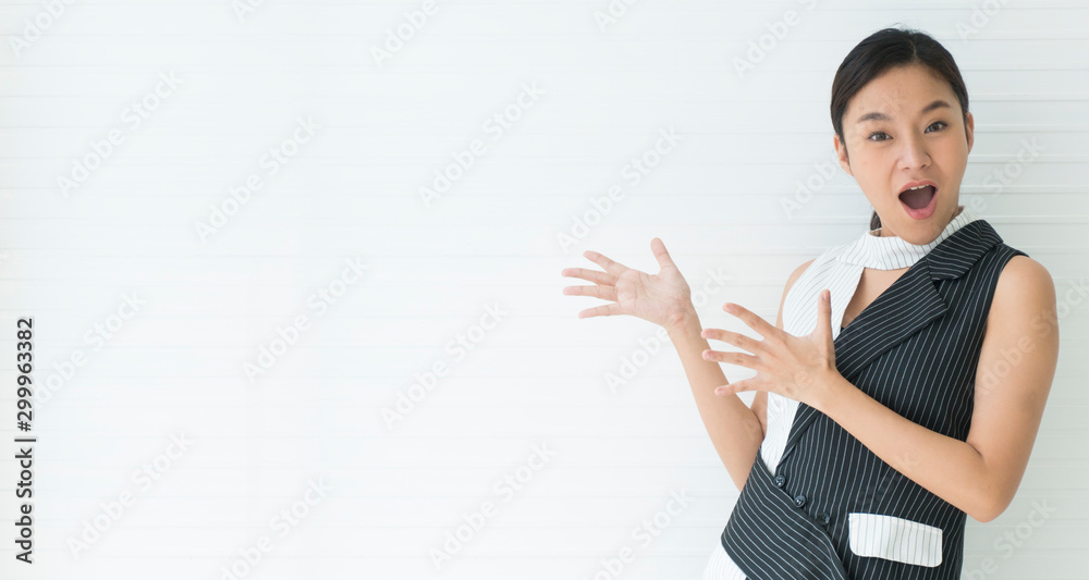 Asian young woman big eyes open wide mouth in excited expression two ...