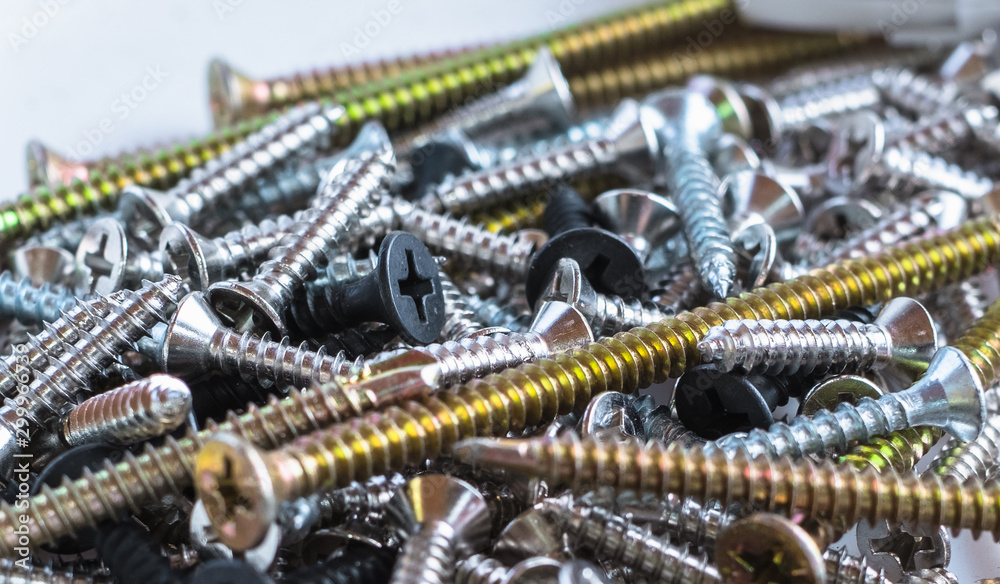 mixed size and color steel or metal screw on wooden top table Stock ...