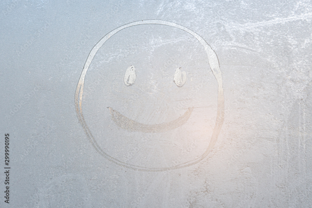 Smiley face on a frozen window covered with frost Stock Photo | Adobe Stock