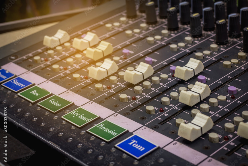 Slide the volume of the audio mixer on the console in the recording and ...