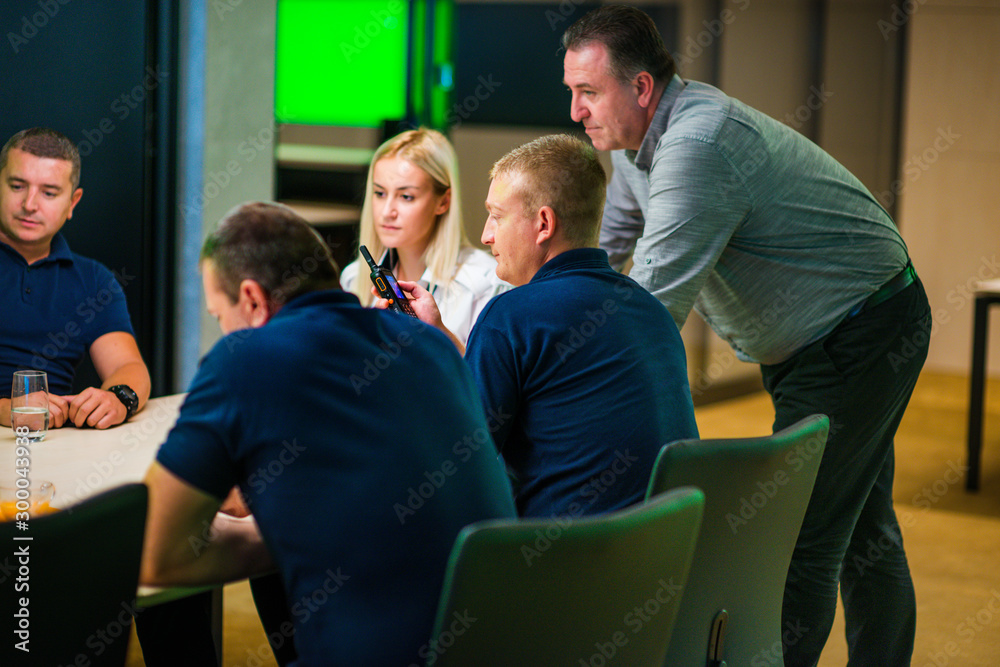 Security guard monitoring modern CCTV cameras in a surveillance room ...