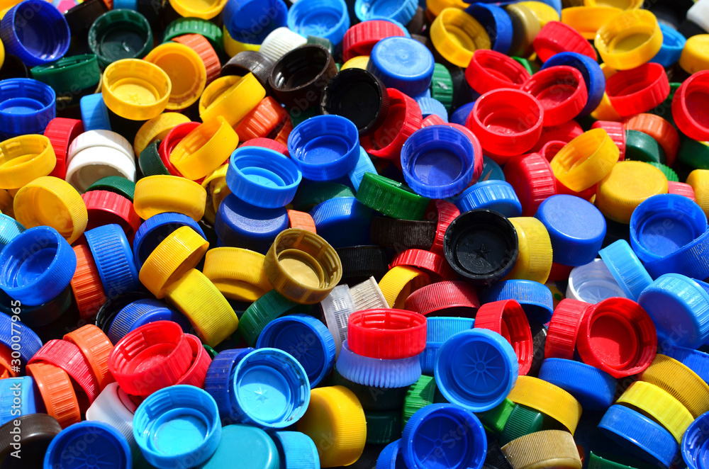 Plastic bottle caps background. Cap material is recyclable.Remove lids ...