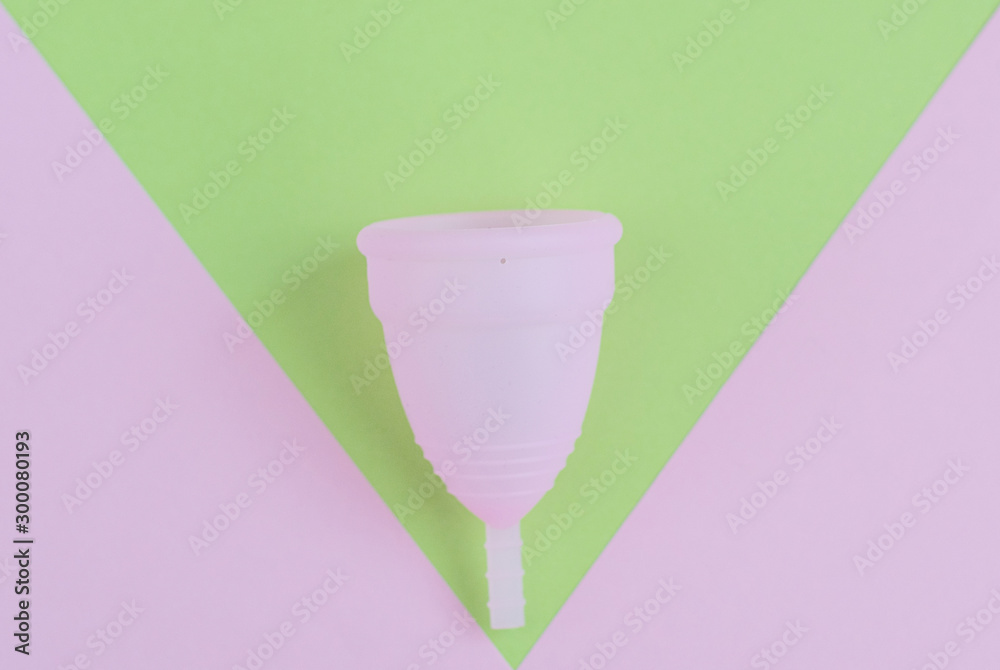 pink menstrual Cup on pink and green background. woman period concept ...