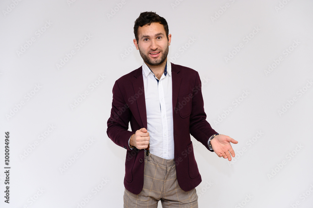 Men's fashion concept. Portrait of a handsome male model showing hands ...