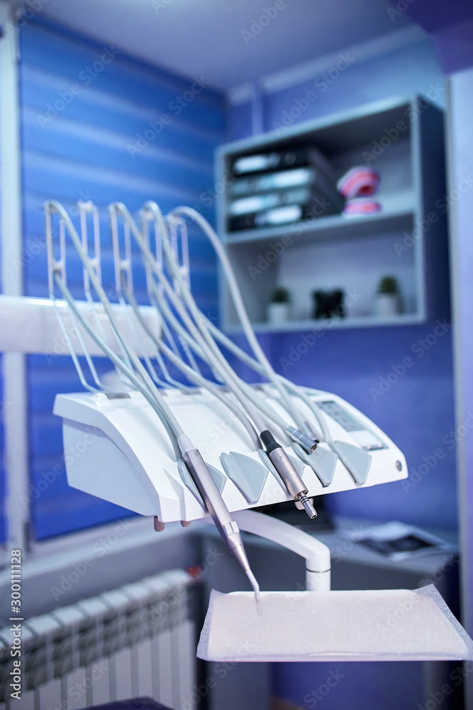 Modern metallic dentist tools and burnishers on a dentist chair in ...