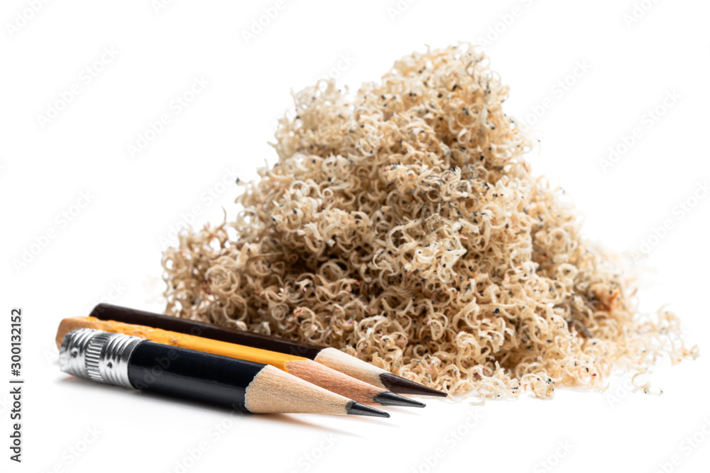 Oversharpened pencil in front of the heap of shavings. Concept of the ...