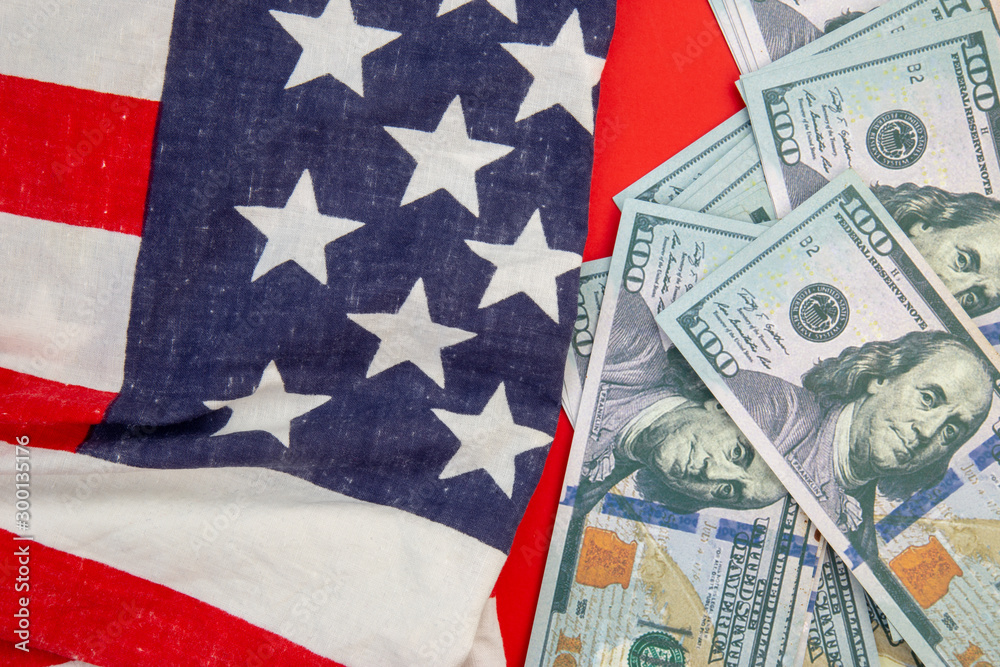 United States or US 100 dollar fake or suvenier currency on a red ...