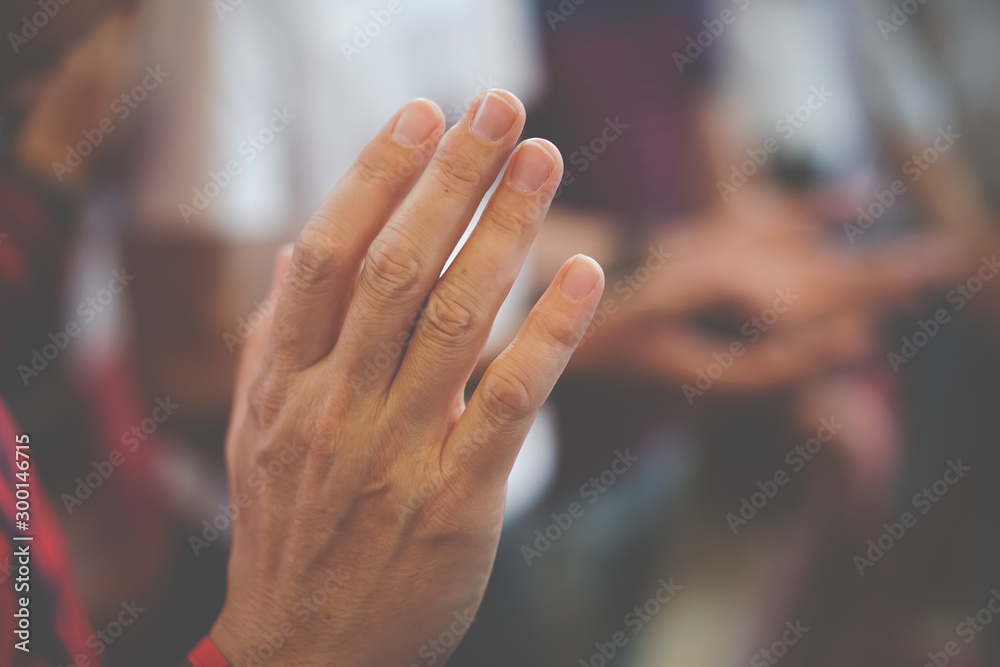 People praying together at Church. Stock Photo | Adobe Stock