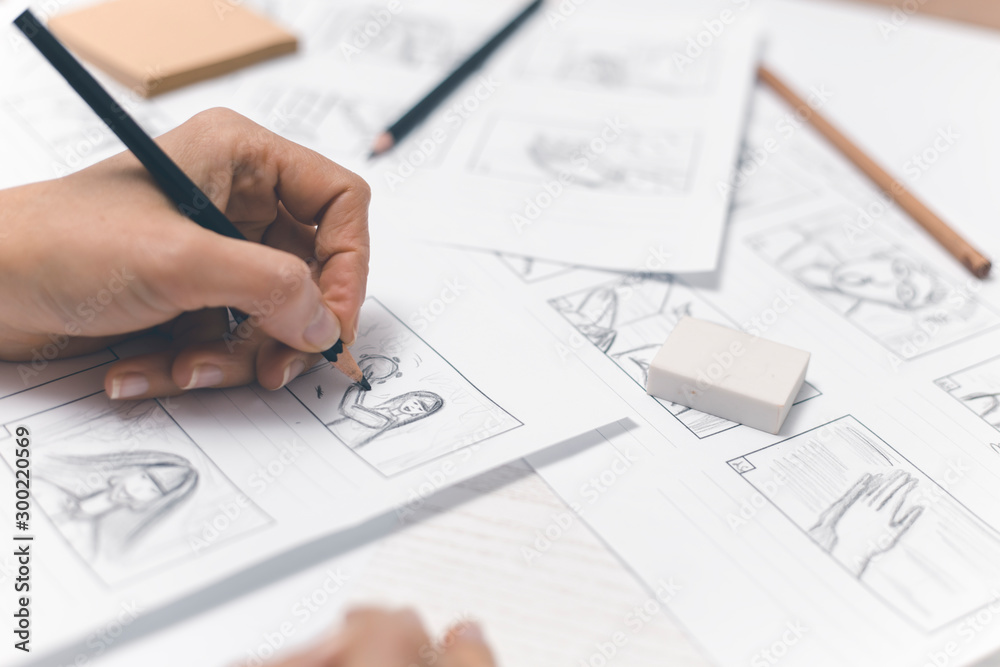 Hands draw a storyboard for the film. Stock Photo | Adobe Stock