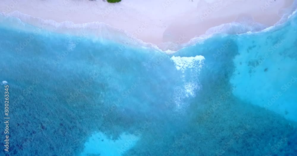 Beautiful sea texture with azure sea water and white waves washing pink ...