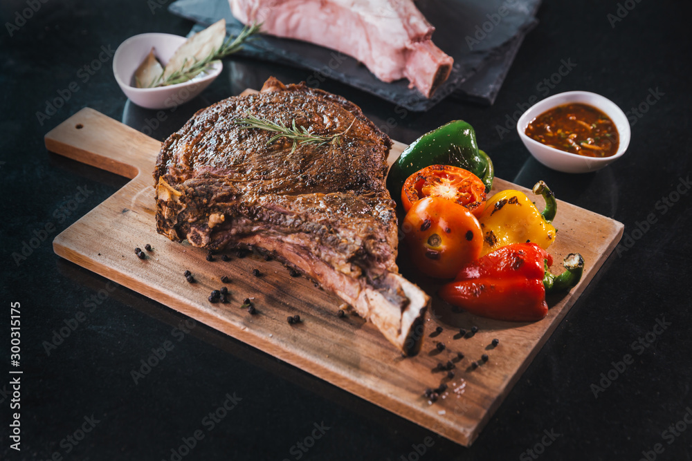 Tomahawk steak. Wagyu tomahawk steak. Tomahawk rib beef steak on wooden ...