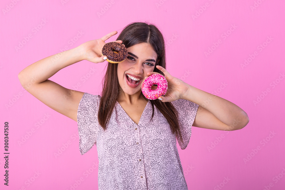 Stylish girl with long hair positively poses, holding fresh pink and ...