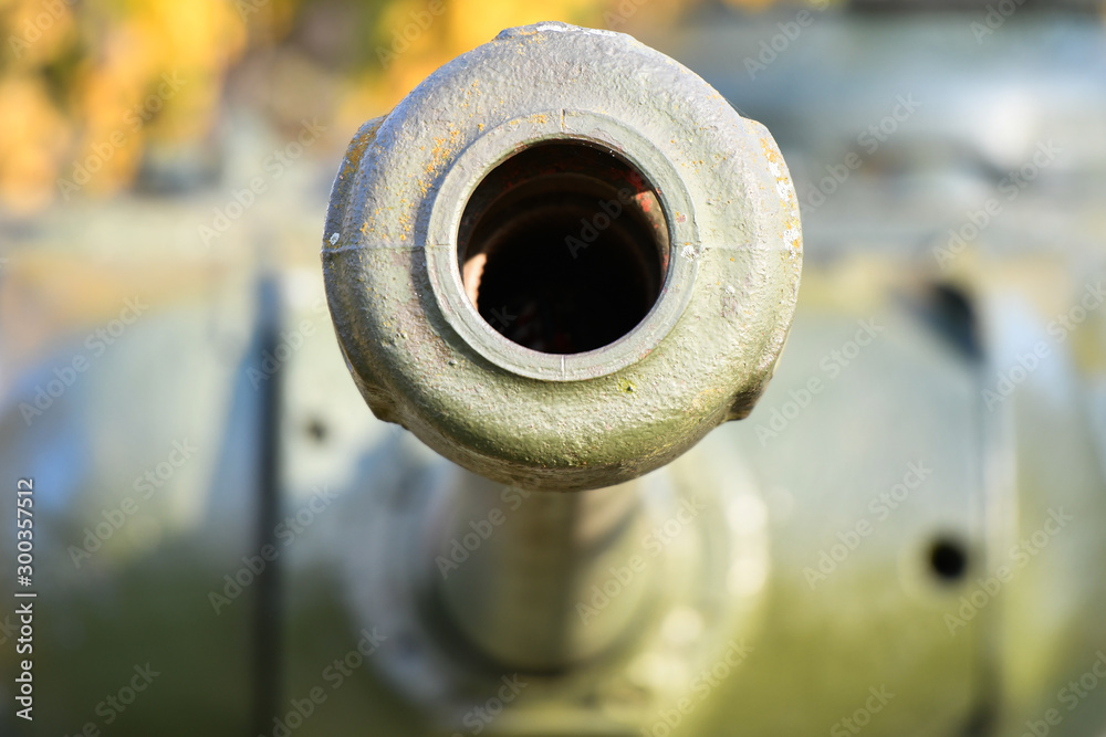 Barrel with a tank close-up. A close up shot of a rusty military tank ...