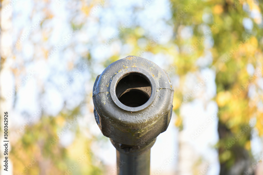 Barrel with a tank close-up. A close up shot of a rusty military tank ...