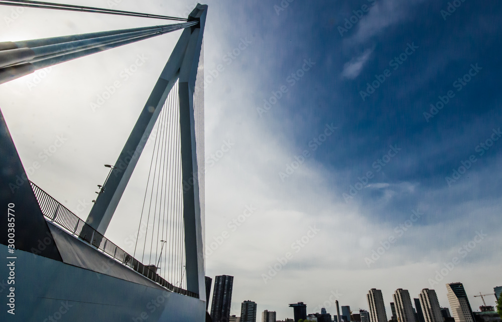 Erasmus bridge, Rotterdam across the river with nice skyline and cloud ...
