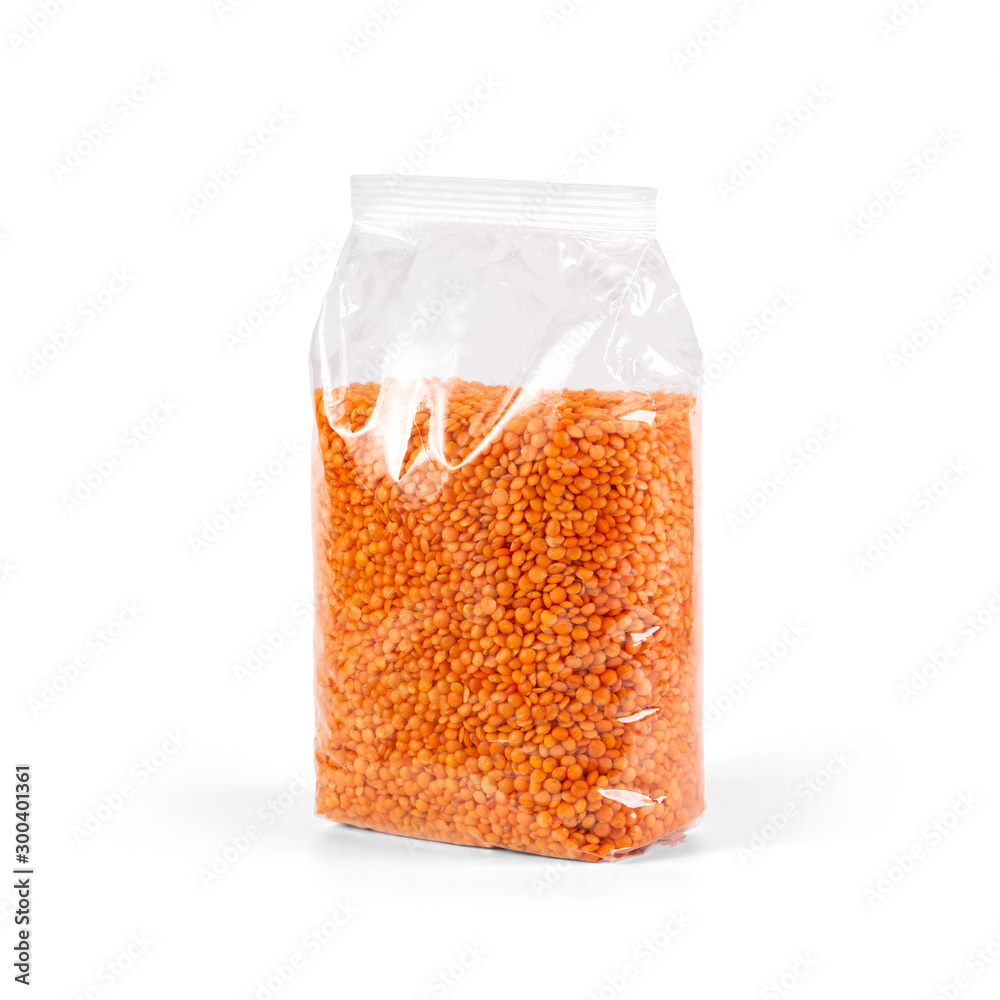 Red Lentils in transparent plastic bag isolated on white background ...