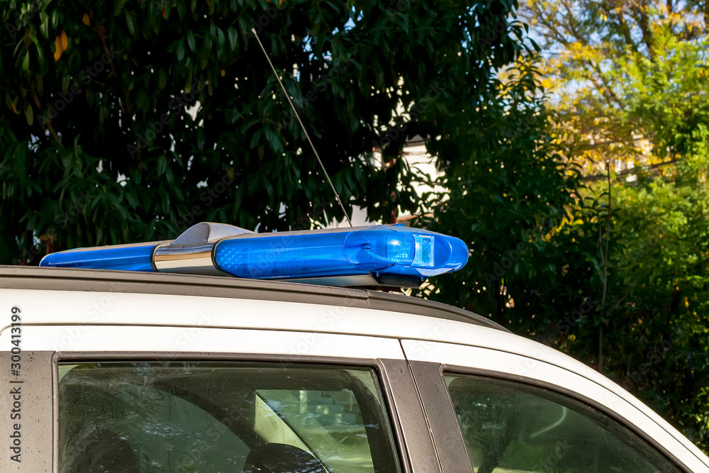 Blue warning lightbar on a police or emergency car. Roof mounted ...