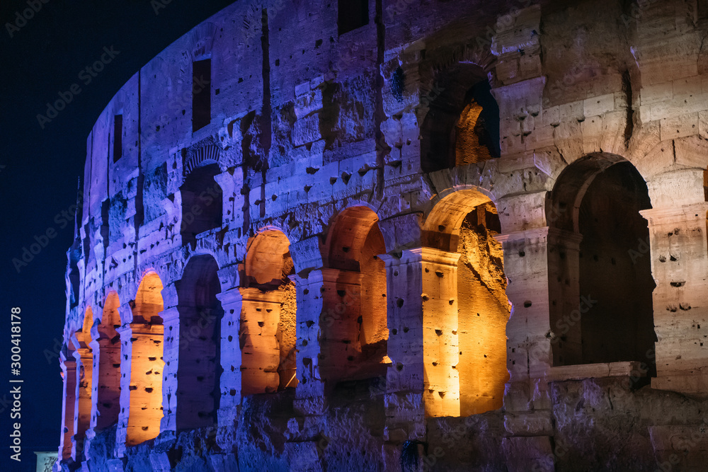 Colosseum, or Coliseum wall with night illumination. Huge Roman ...