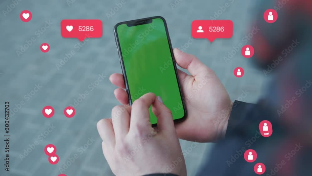 Close up hands woman holding phone with vertical green screen on busy ...