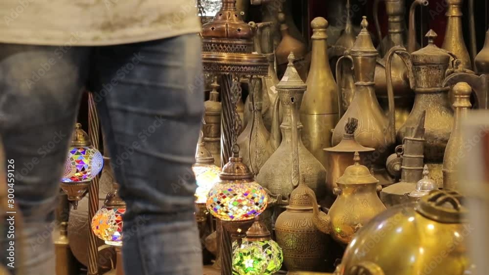 Traditional oriental souvenirs. Coated vases and coffee pots. Multi ...