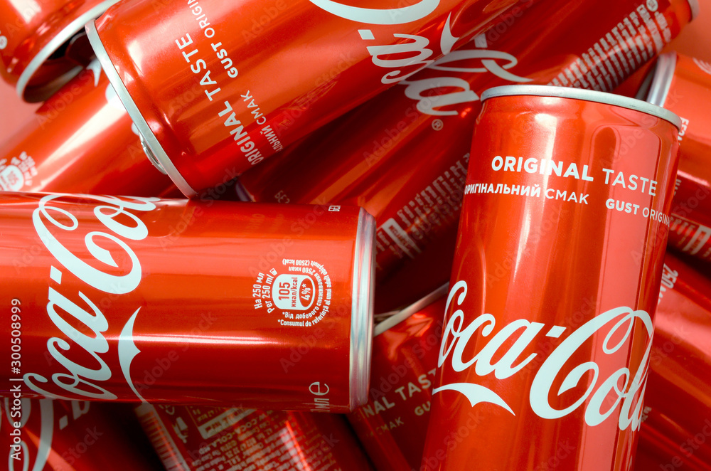 Coca-Cola logo printed on aluminium cans close up. Most famous soda ...