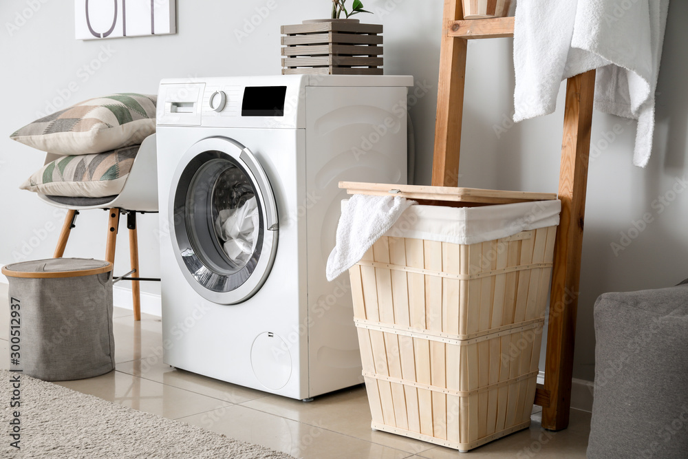 Interior of home laundry room with modern washing machine Stock Photo ...