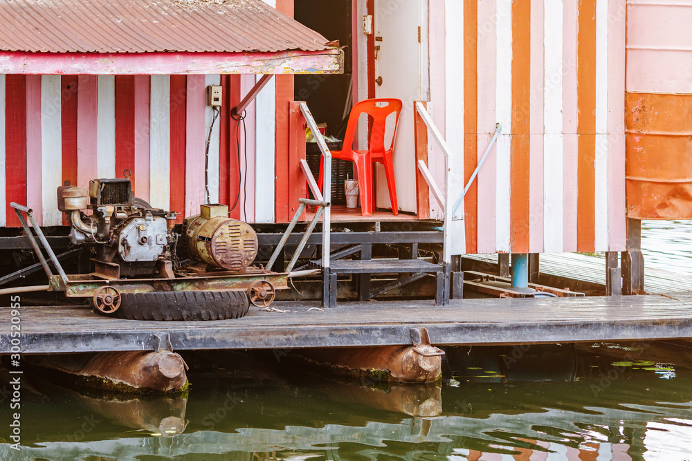 Foto de The old electricity generator for floating wooden raft house by ...
