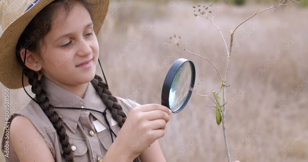 Children exploring world. Little girl of seven years old in straw hat ...
